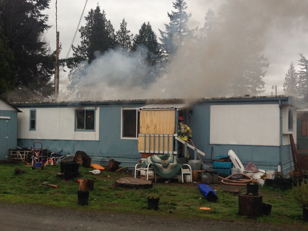 WCFD7 firefighter heads into a mobile home on fire in the 6100 block of ...